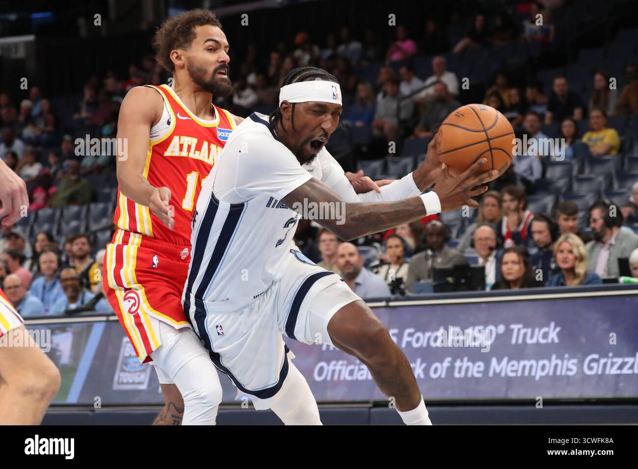 Atlanta Hawks guard Trae Young (11) defends Memphis Grizzlies guard ...
