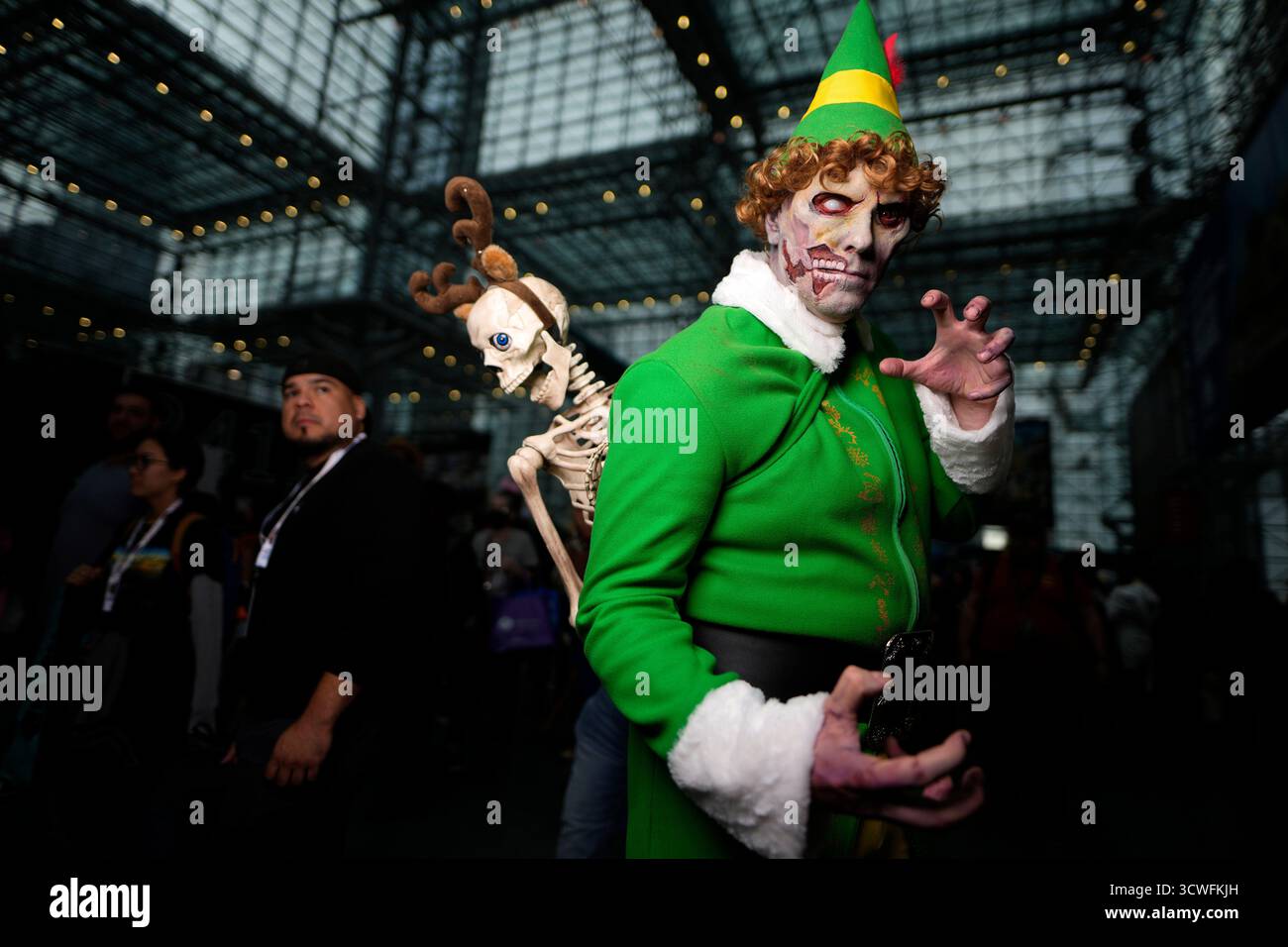 An attendee dressed as a zombie Buddy the Elf poses during New York ...
