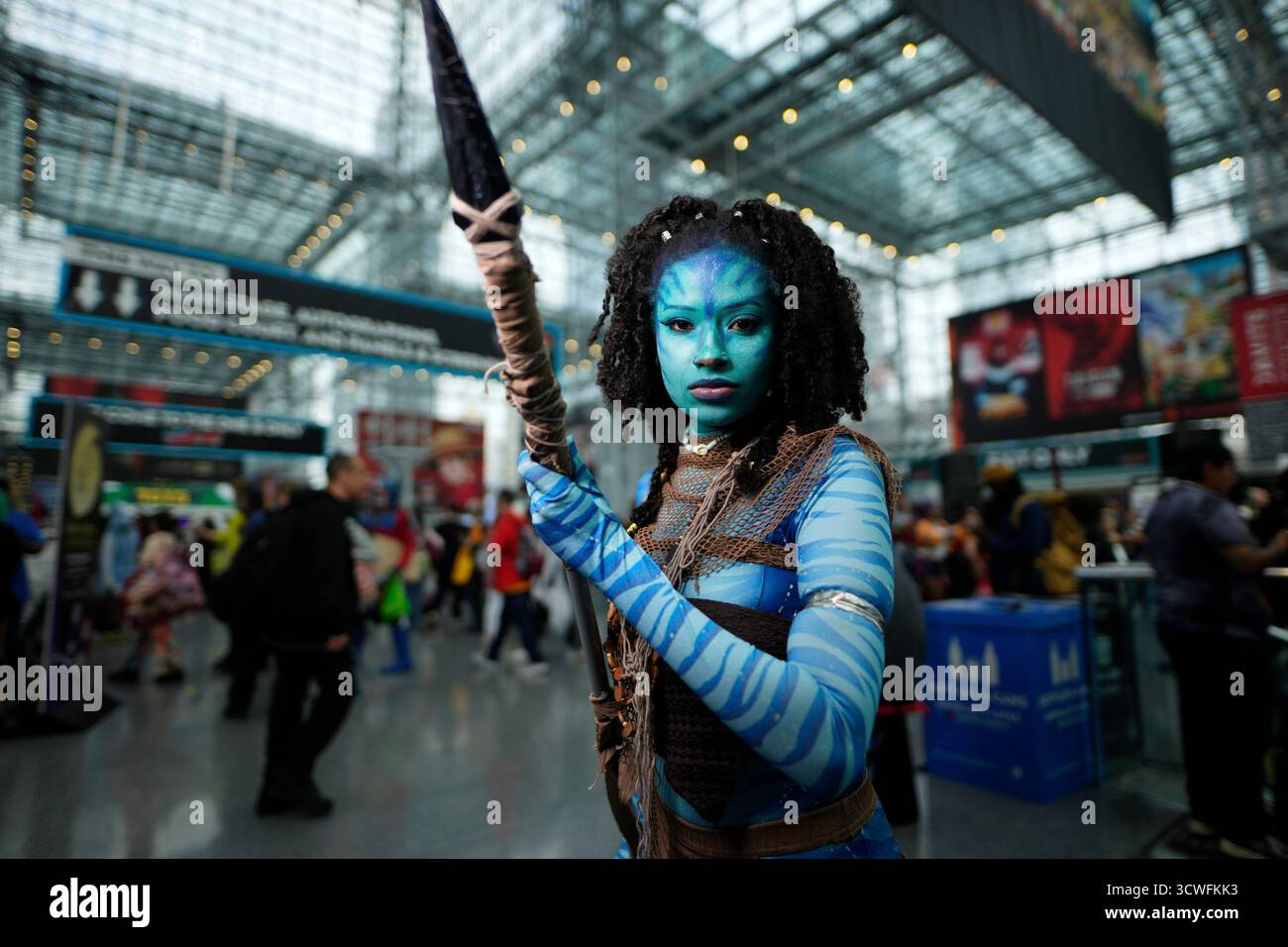 An attendee dressed as a Na'vi from Avatar poses during New York Comic ...