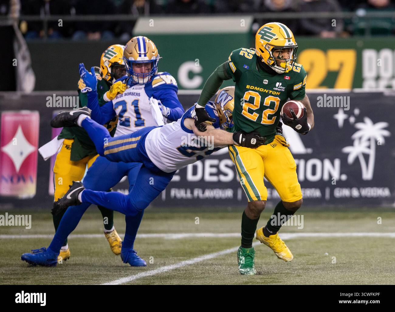 Winnipeg Blue Bombers' Ethan Ball (29) hangs onto Edmonton Elks' Javon ...