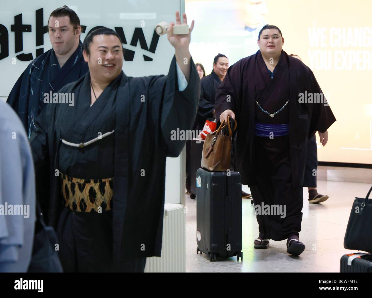 Sumo wrestlers, including Yokozuna Onosato, arrive at Heathrow Airport ...