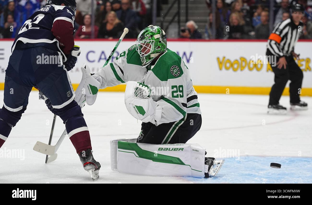 Dallas Stars goaltender Jake Oettinger (29) deflects a shot off the ...