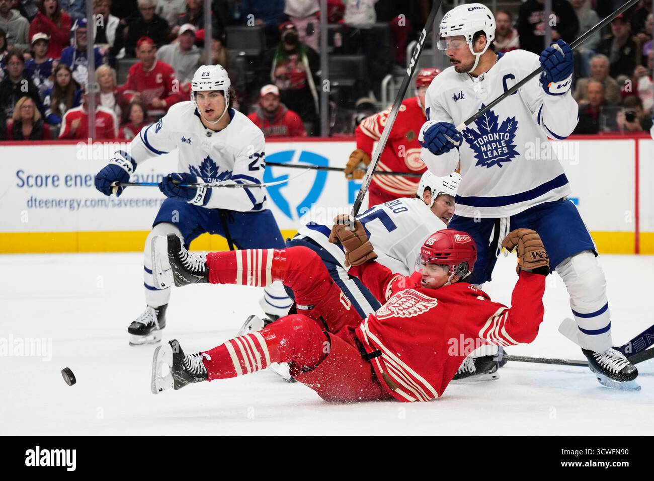 Detroit Red Wings center Emmitt Finnie, bottom front, collides with ...
