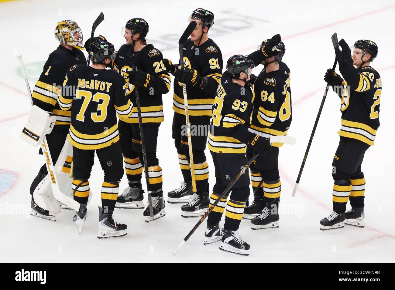 The Boston Bruins celebrate after defeating the Buffalo Sabres in an ...