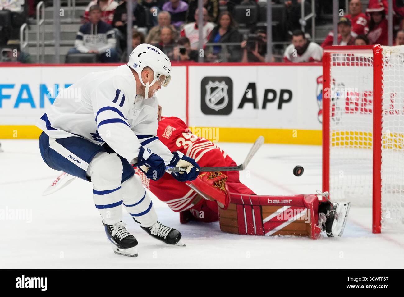 Toronto Maple Leafs center Max Domi, left, attempts to shoot against ...