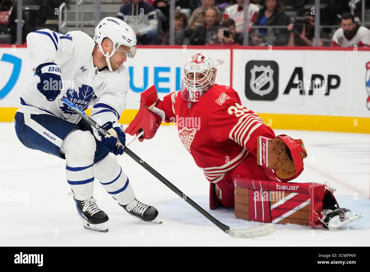 Toronto Maple Leafs center Max Domi, left, attempts to shoot against ...
