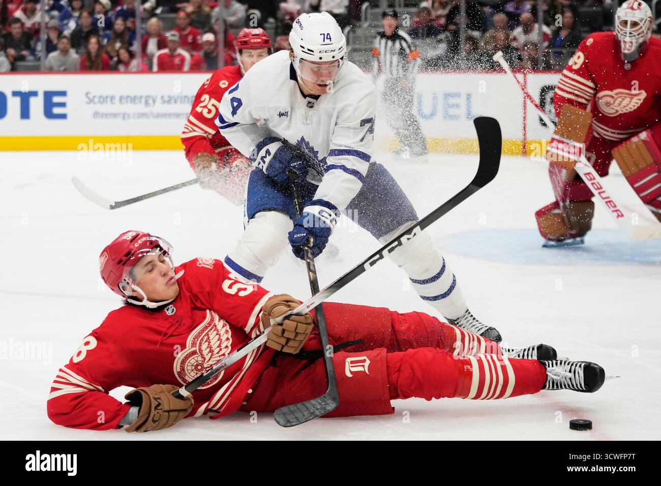 Detroit Red Wings center Emmitt Finnie, left, and Toronto Maple Leafs ...