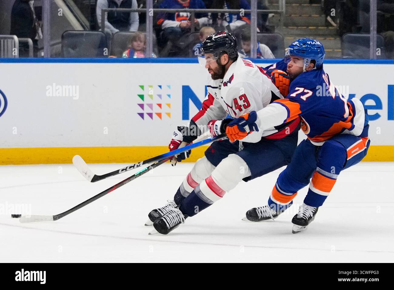 New York Islanders' Tony Deangelo (77) defends Washington Capitals' Tom ...