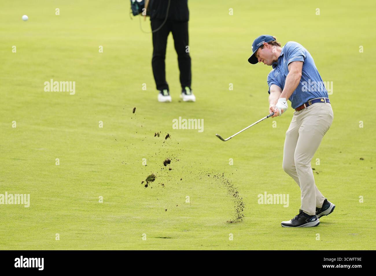 Max Greyserman, of the U.S., hits from the fairway on the second hole ...