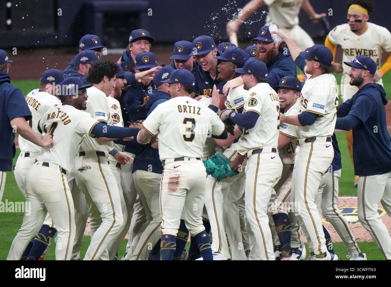 The Milwaukee Brewers celebrate after winning Game 5 of baseball's ...