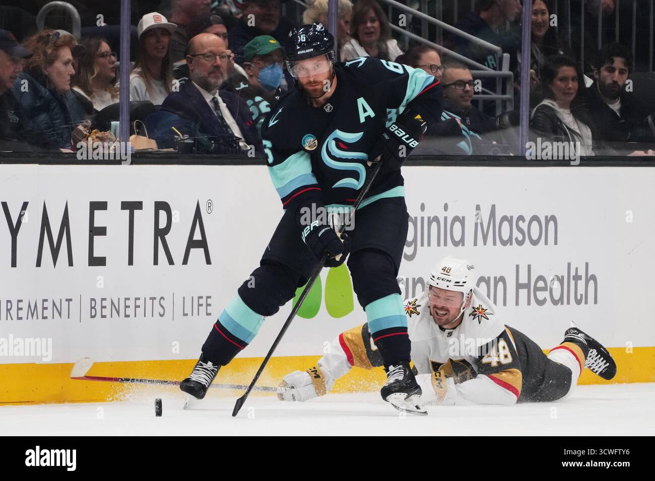 Seattle Kraken defenseman Adam Larsson (6) claims the puck from Vegas ...