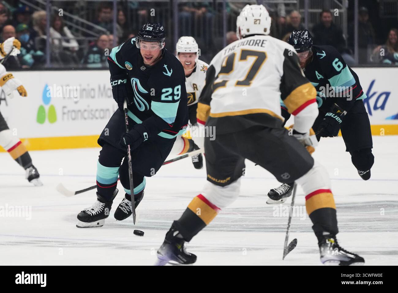 Seattle Kraken defenseman Vince Dunn (29) looks to move the puck past ...