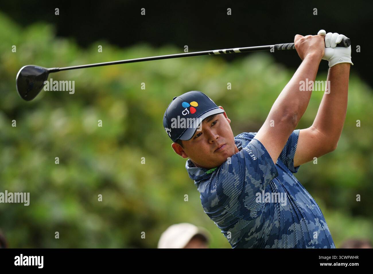 Kim Si-woo, of South Korea, tees off on the second hole during the ...