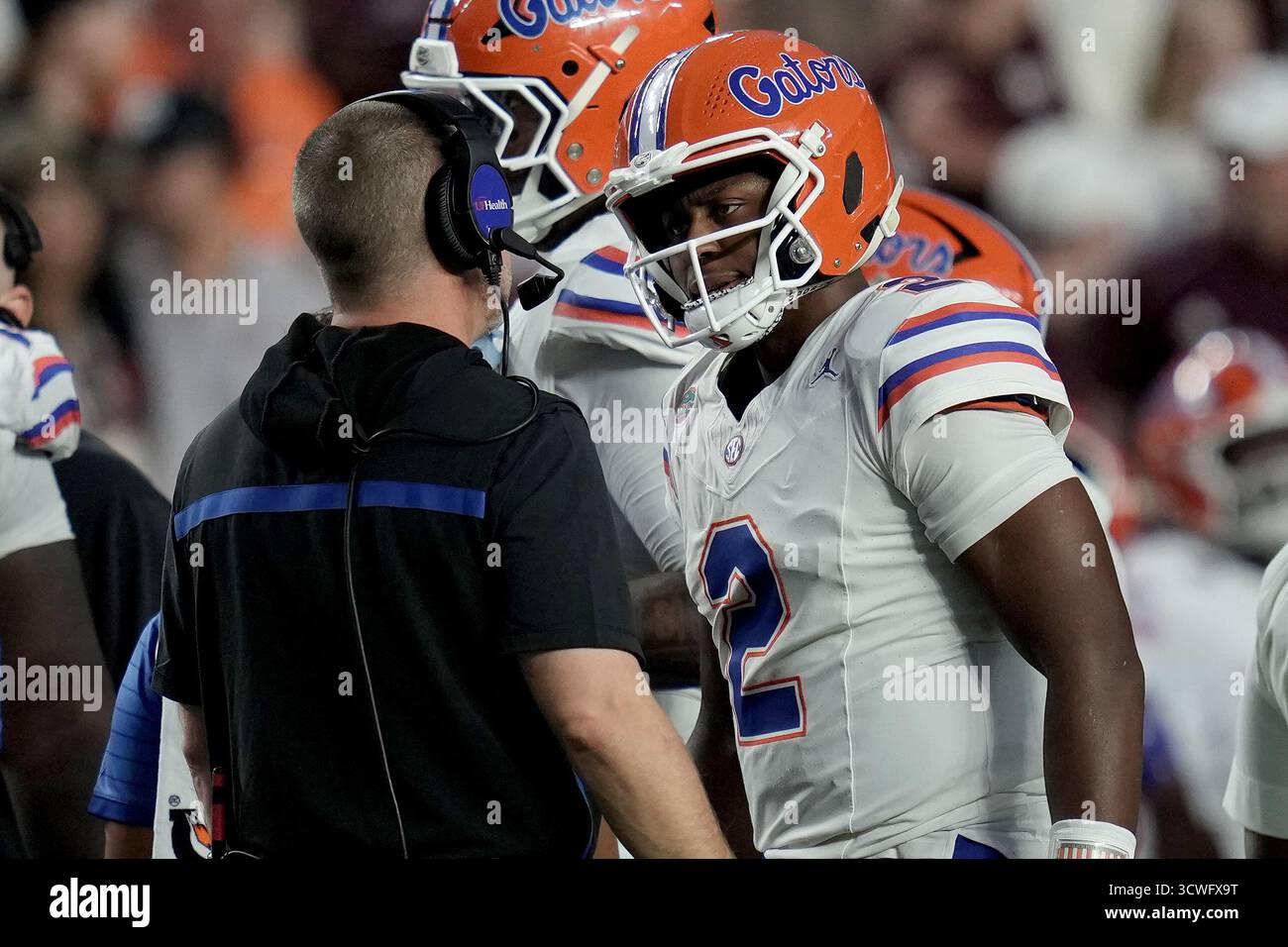 Florida quarterback DJ Lagway, right, talks with head coach Billy ...
