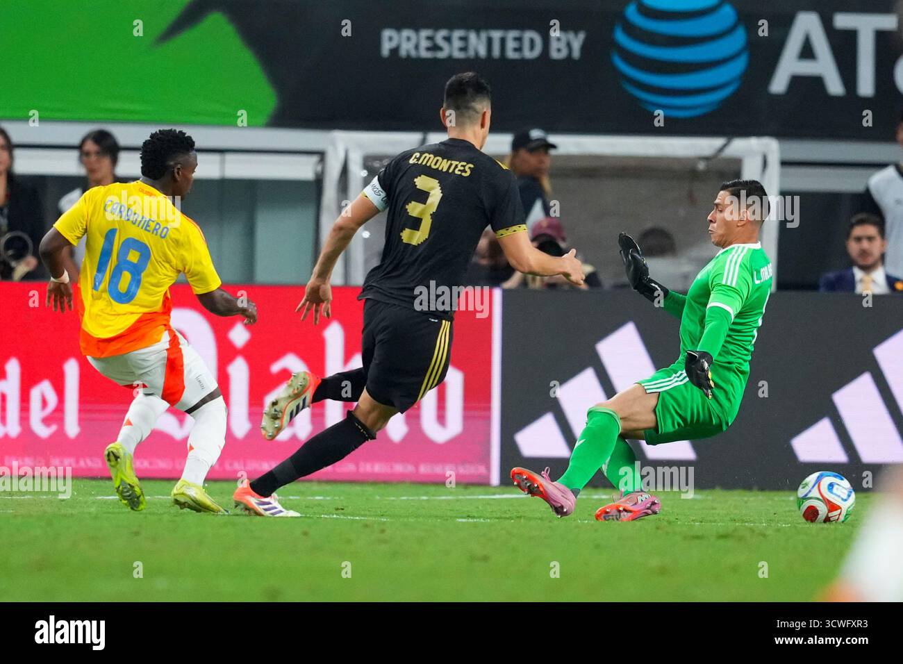 Colombia's Johan Carbonero (18) scores a goal on Mexico's Ángel Malagón ...