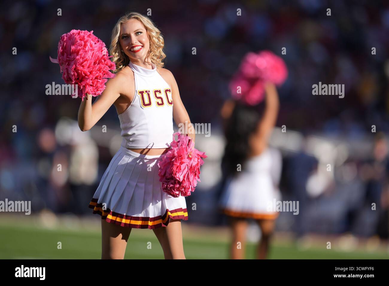 Cheerleaders Perform During An Ncaa College Football Game Between