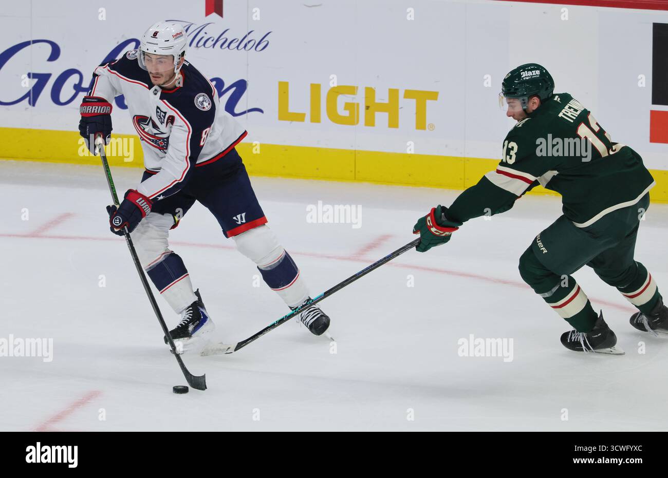 Columbus Blue Jackets defenseman Zach Werenski (8) and Minnesota Wild ...