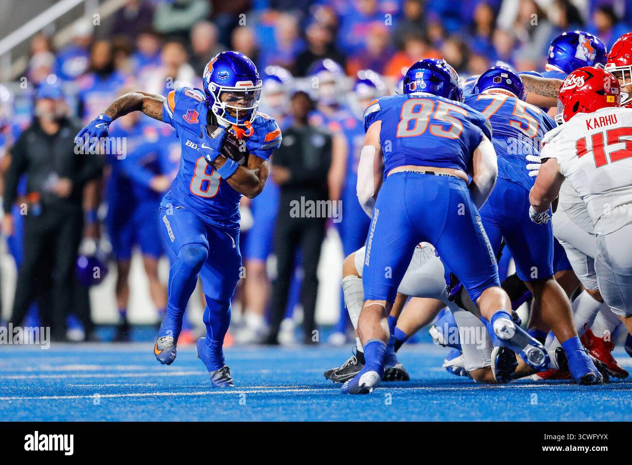 Boise State running back Malik Sherrod (8) runs around the block of ...