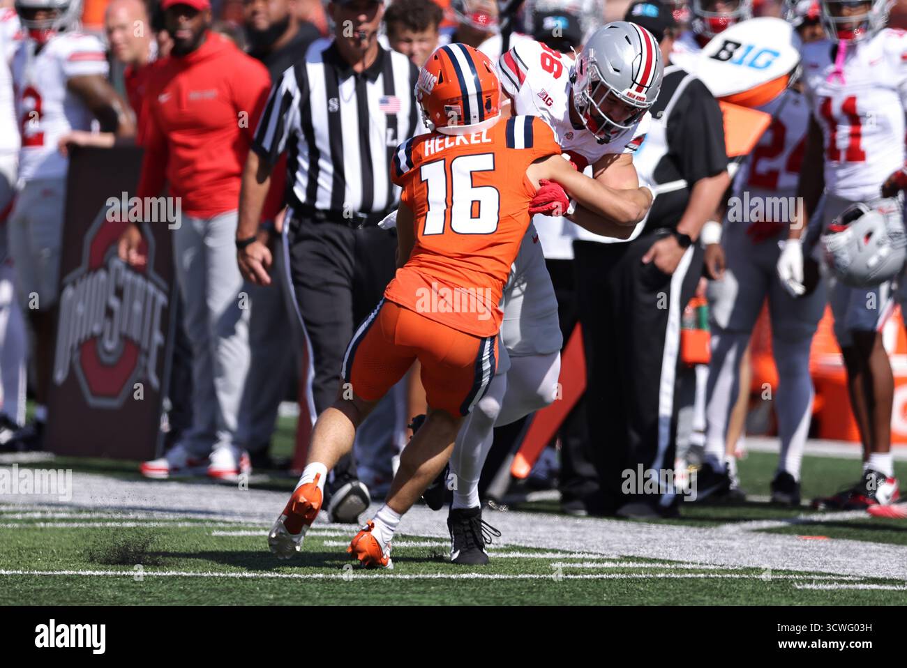 Illinois defensive back Tanner Heckel (16) tackles Ohio State tight end ...