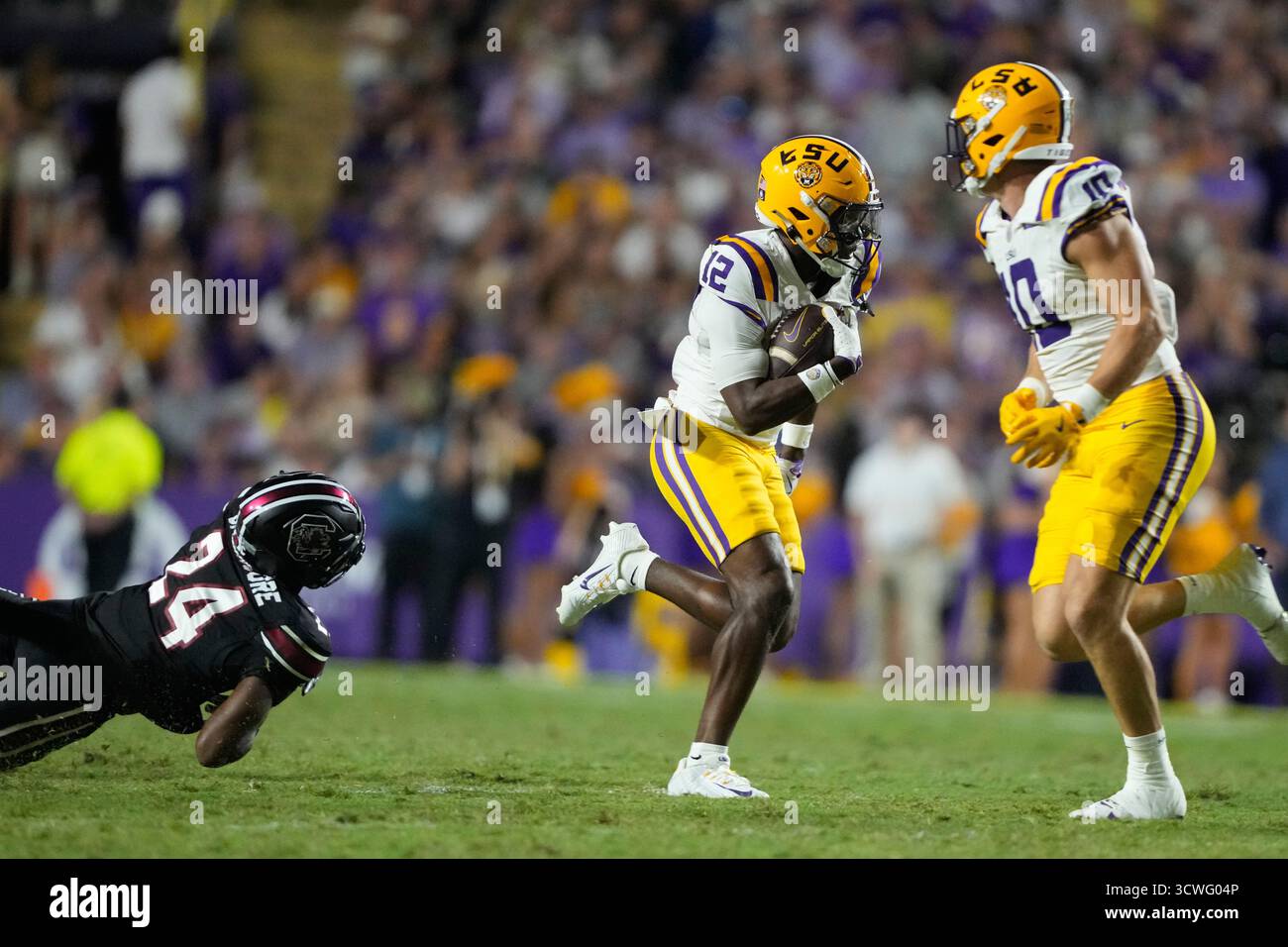 LSU wide receiver Kyle Parker (12) carries for a touchdown past South ...