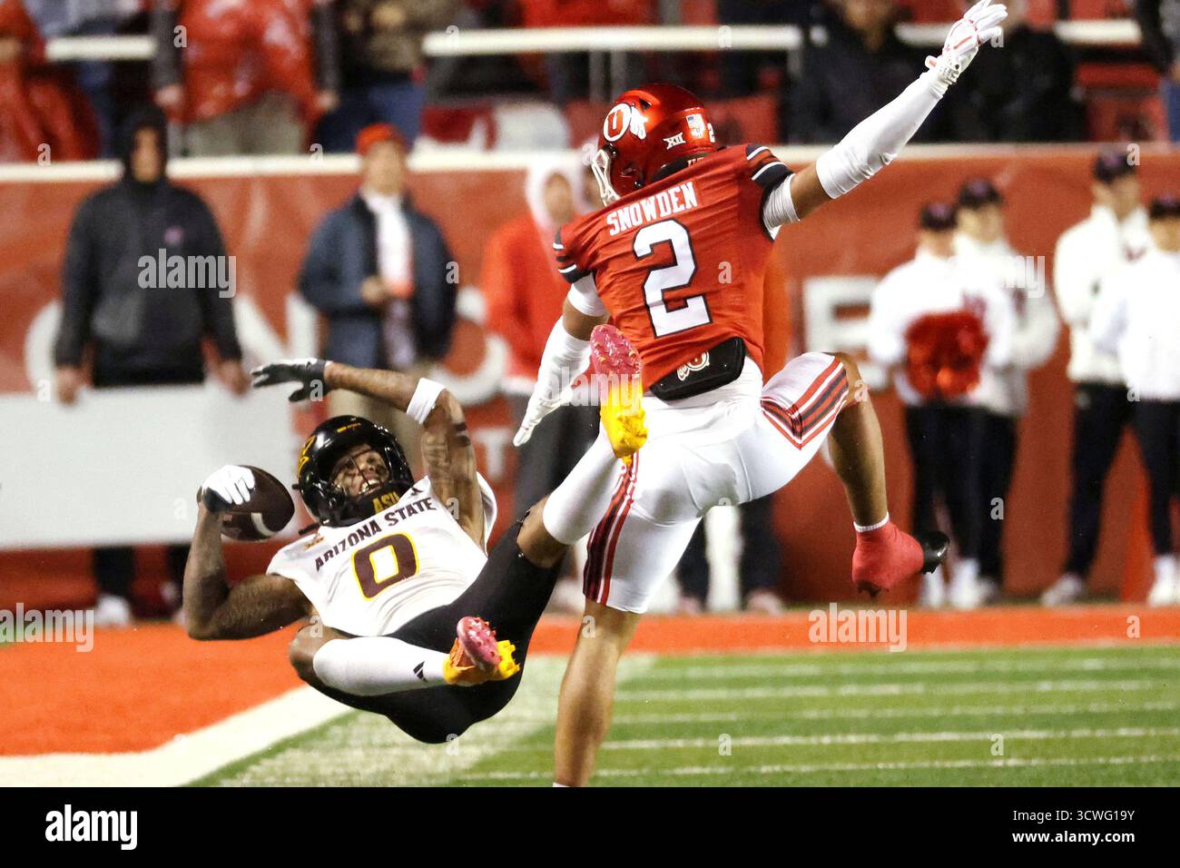 Arizona wide receiver Jordyn Tyson, left, can't make a catch under ...