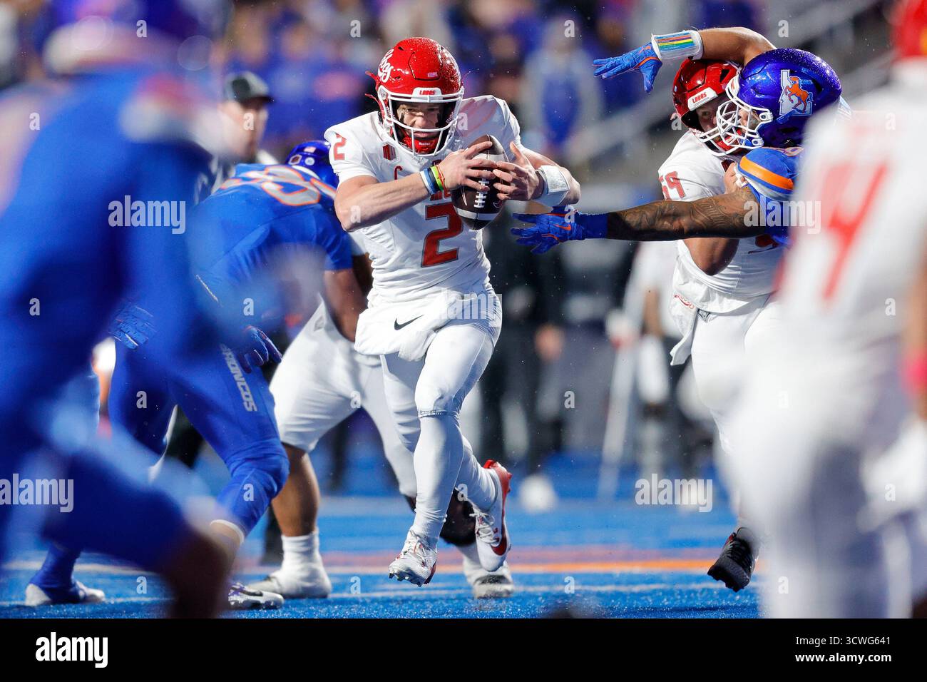 New Mexico quarterback Jack Layne (2) looks to scramble as the Boise ...