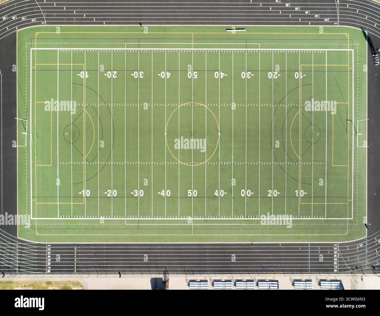 A football field with a white line down the middle Stock Photo - Alamy