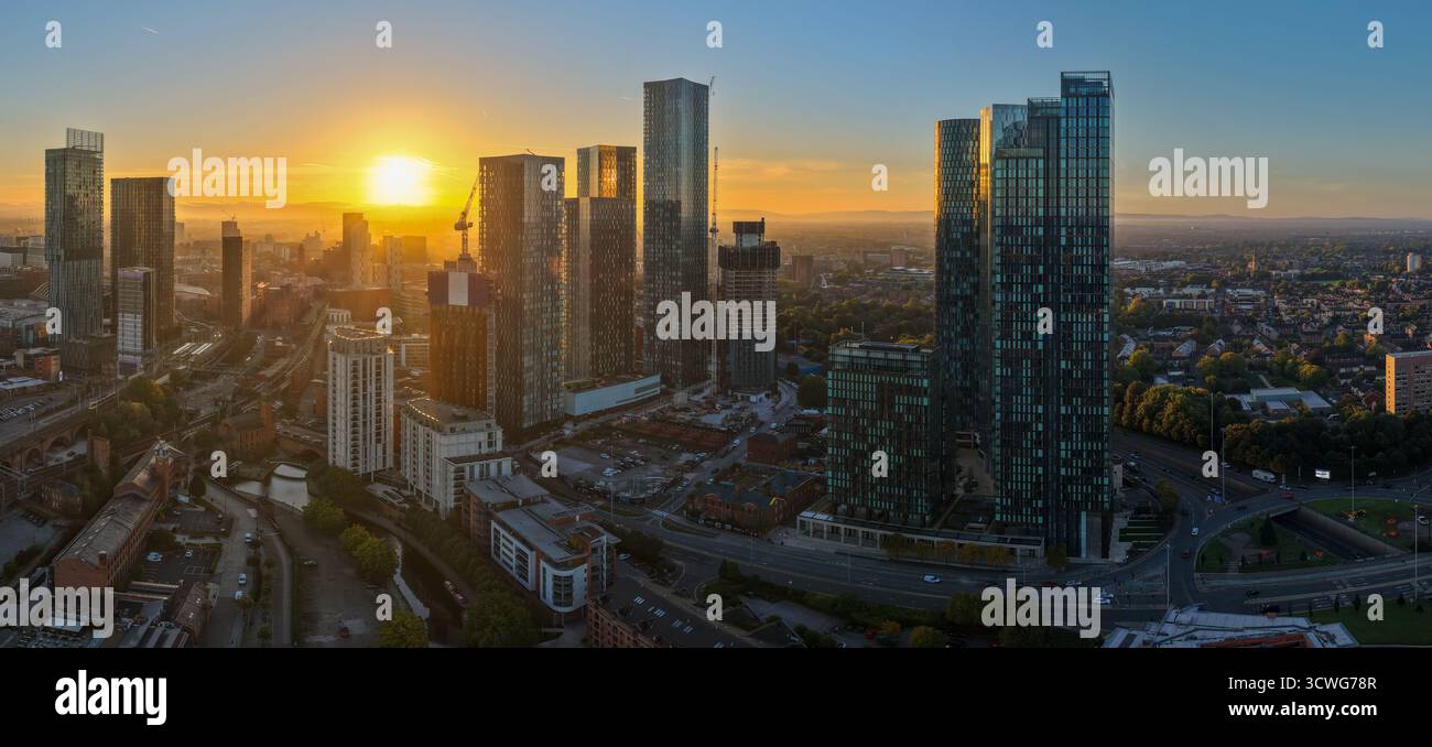Sunrise aerial panorama of Deansgate Square and Manchester skyline ...