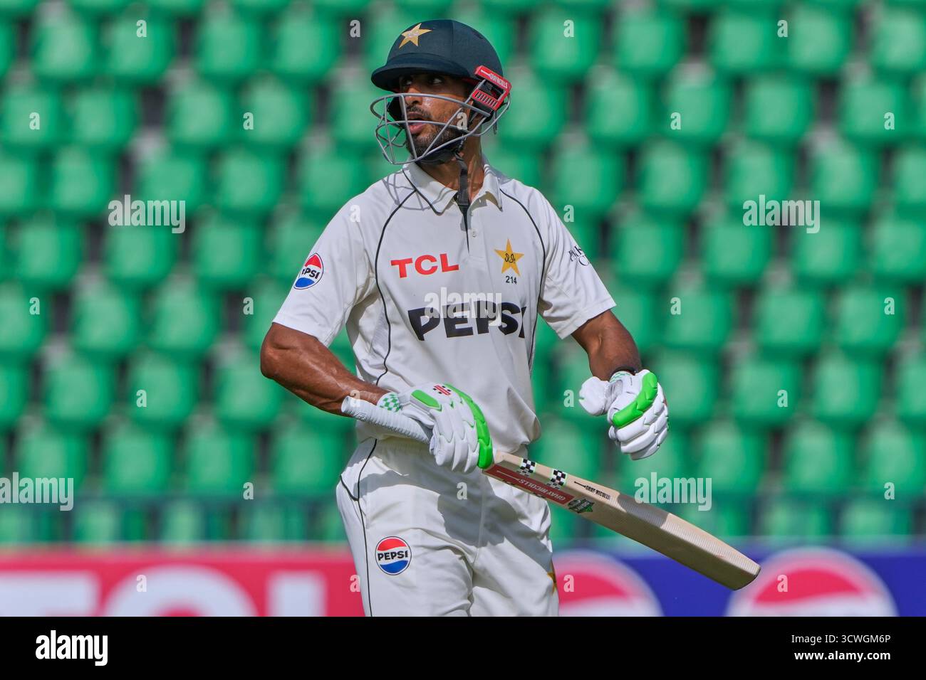 Pakistan's Shan Masood reacts as he walks off the field after his dismissal during the first day ...