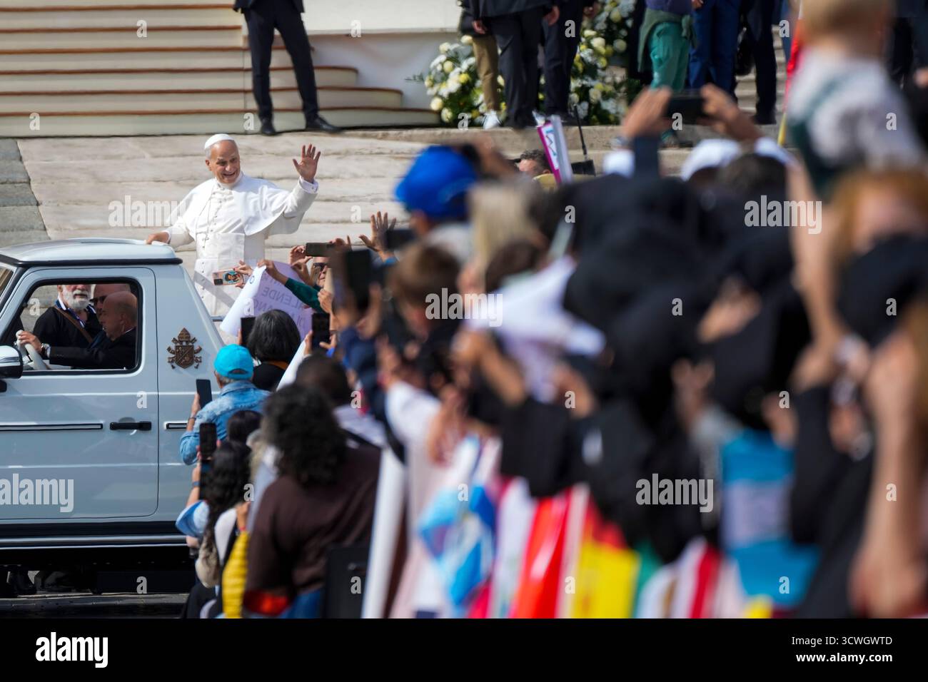 Pope Leo XIV tours among the faithful in his popemobile after presiding ...