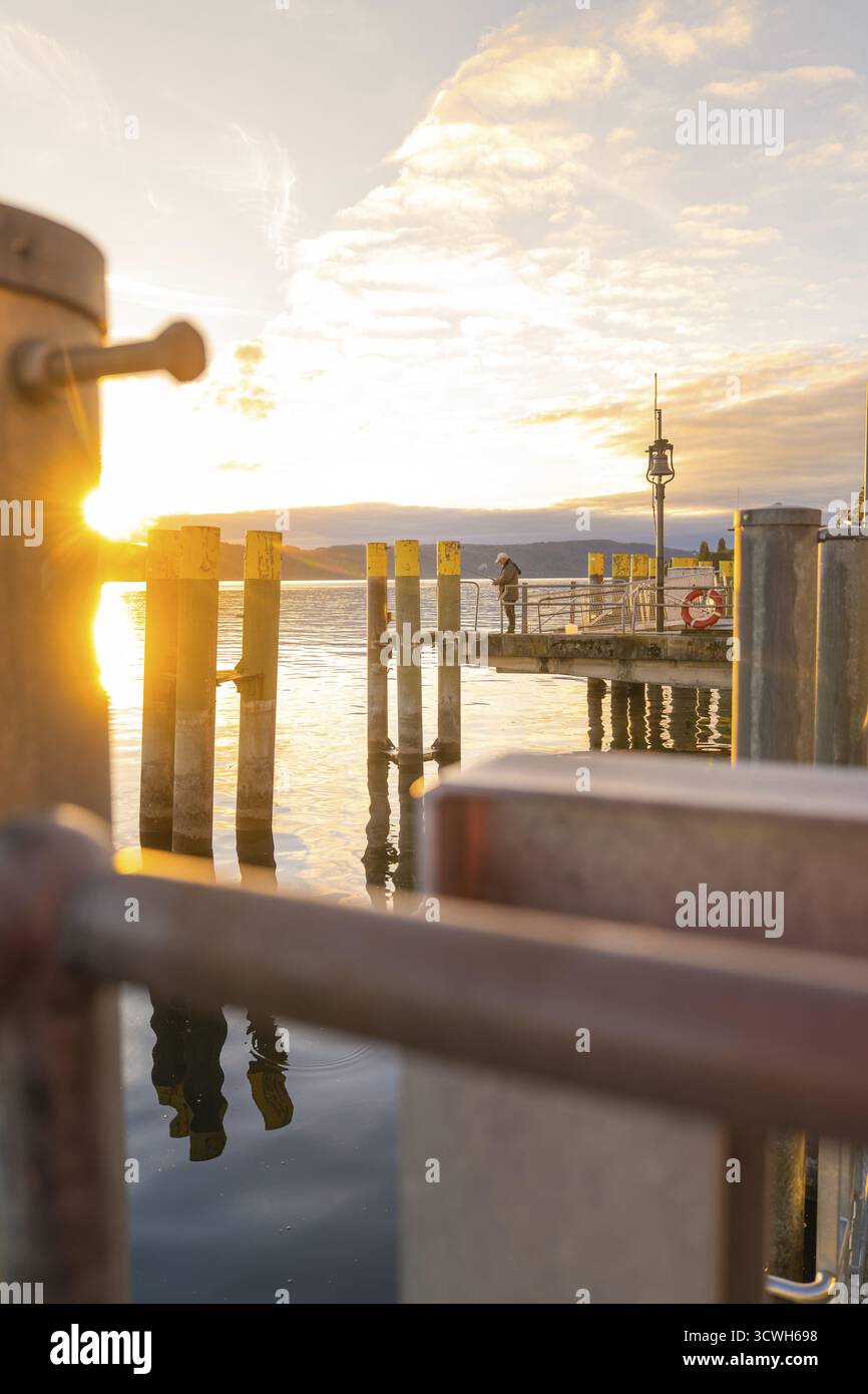 Sunset scene from a jetty overlooking a lake, Ueberlingen, Lake ...