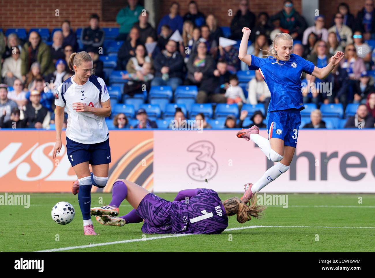 Tottenham Hotspur goalkeeper Lize Kop (centre) makes a save at the feet ...