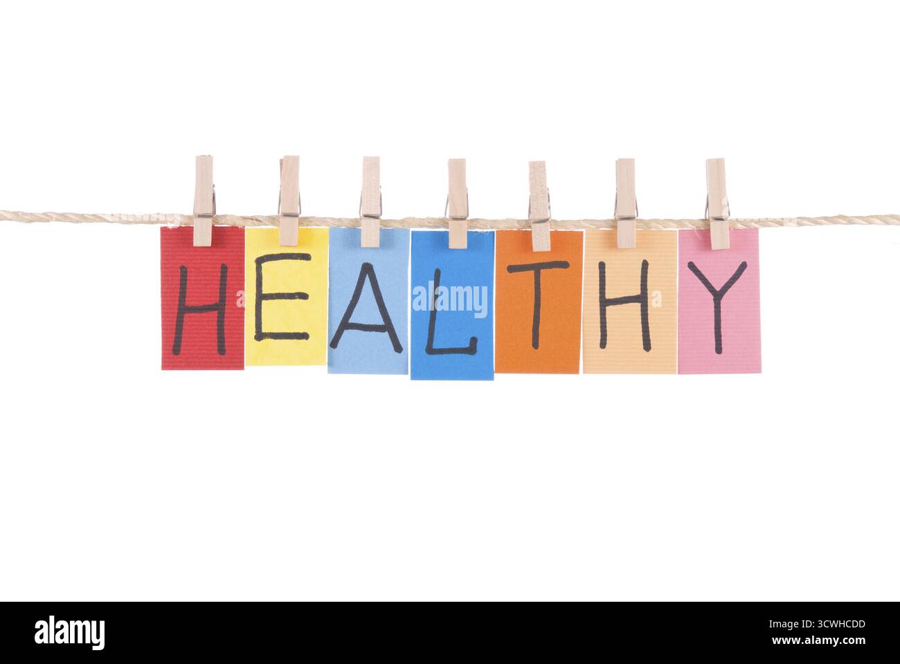 Healthy, paper words card hang by wooden peg Stock Photo - Alamy