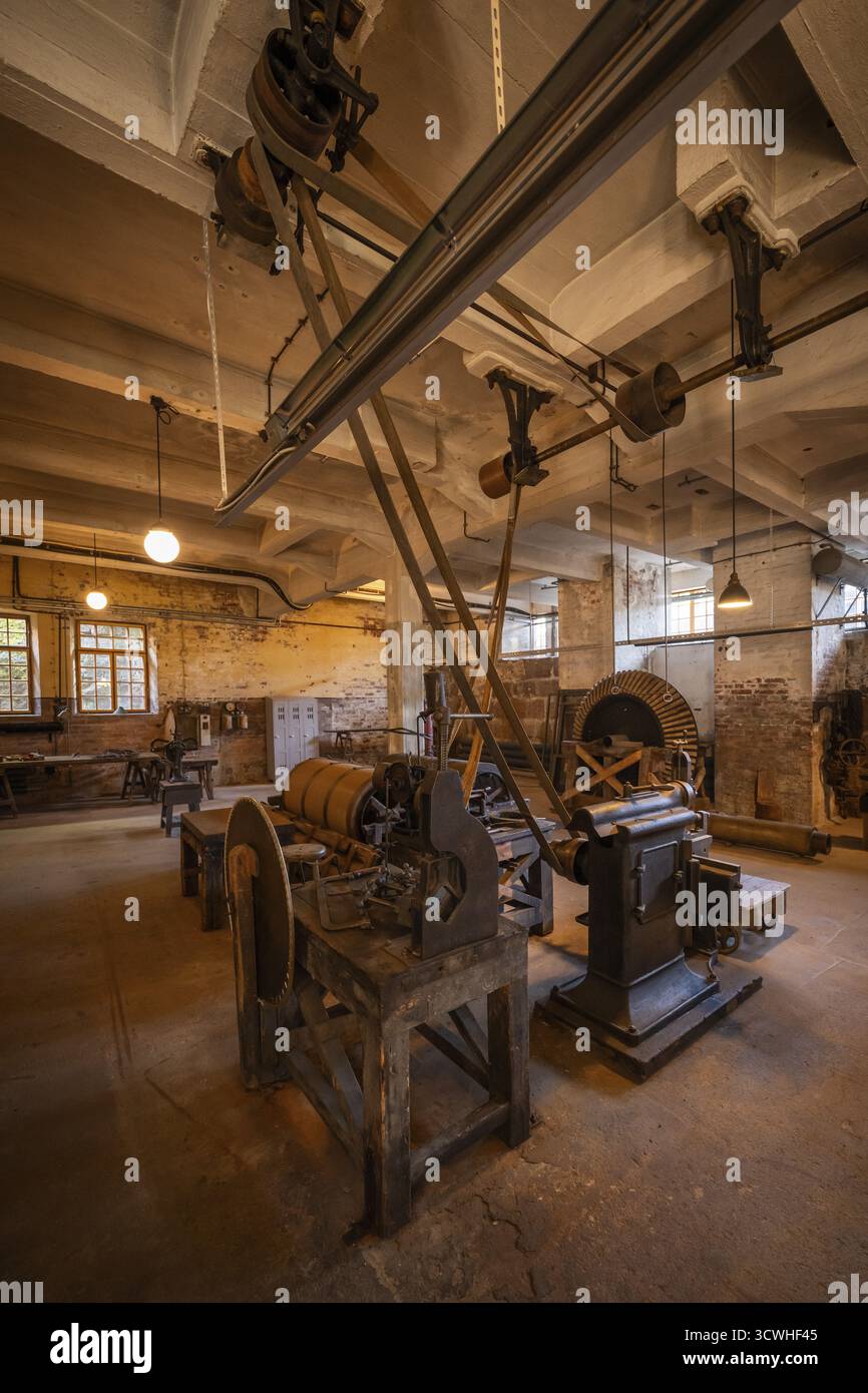 Factory hall with historical machines for the production of cardboard ...