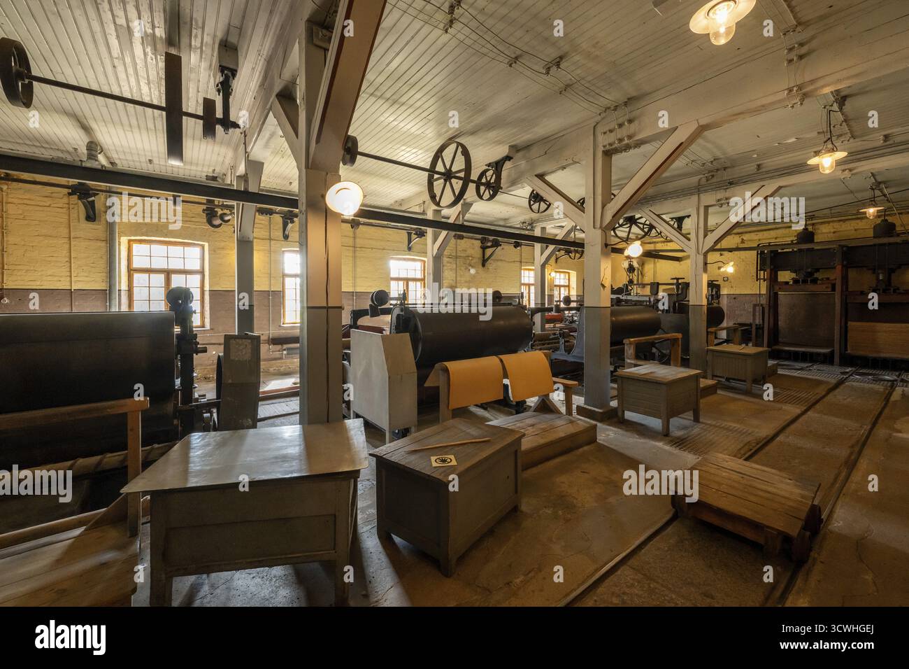 Factory hall with historical machines for the production of cardboard ...