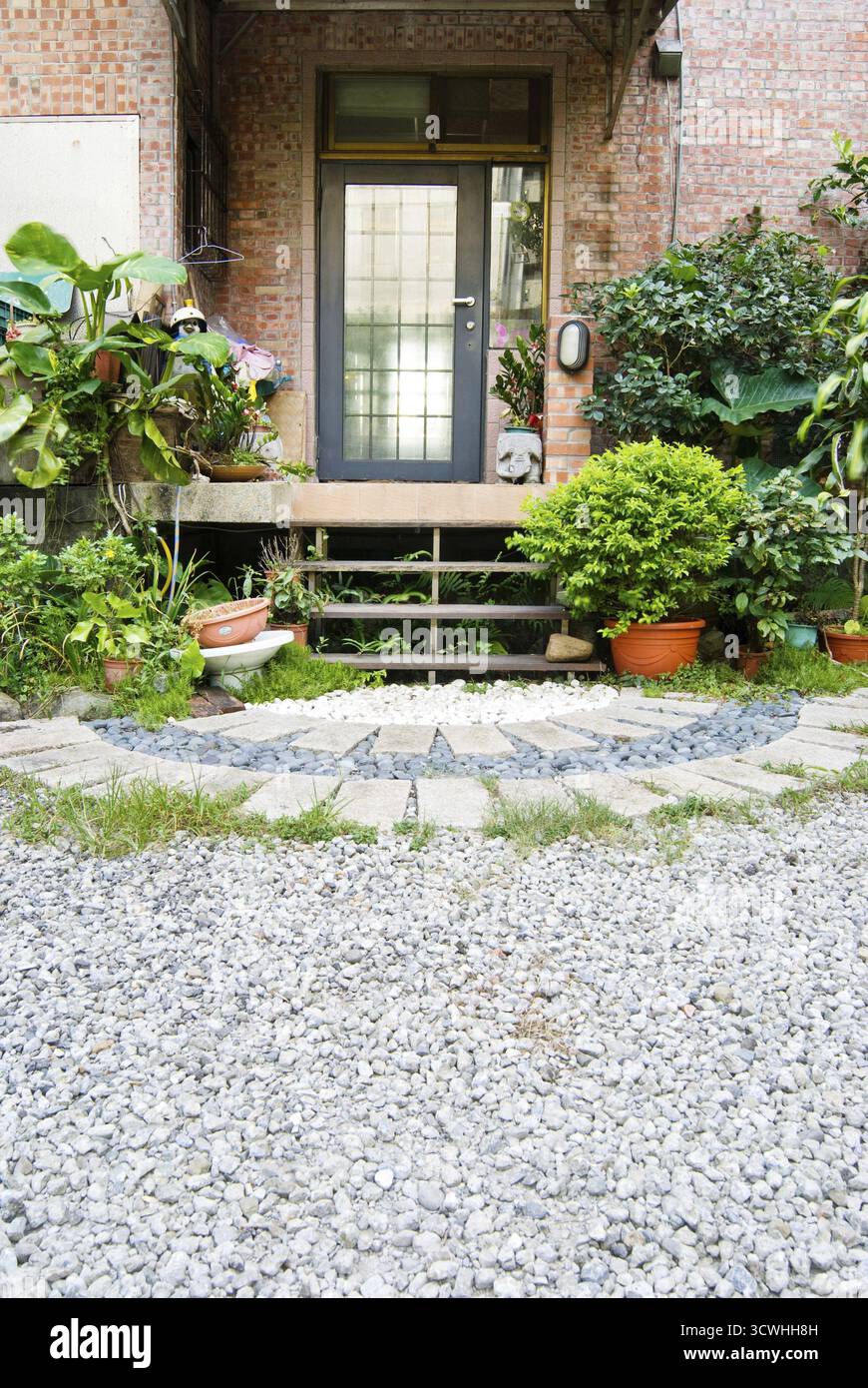 Villa backyard with green plant and pebbles. Chinese yard Stock Photo ...