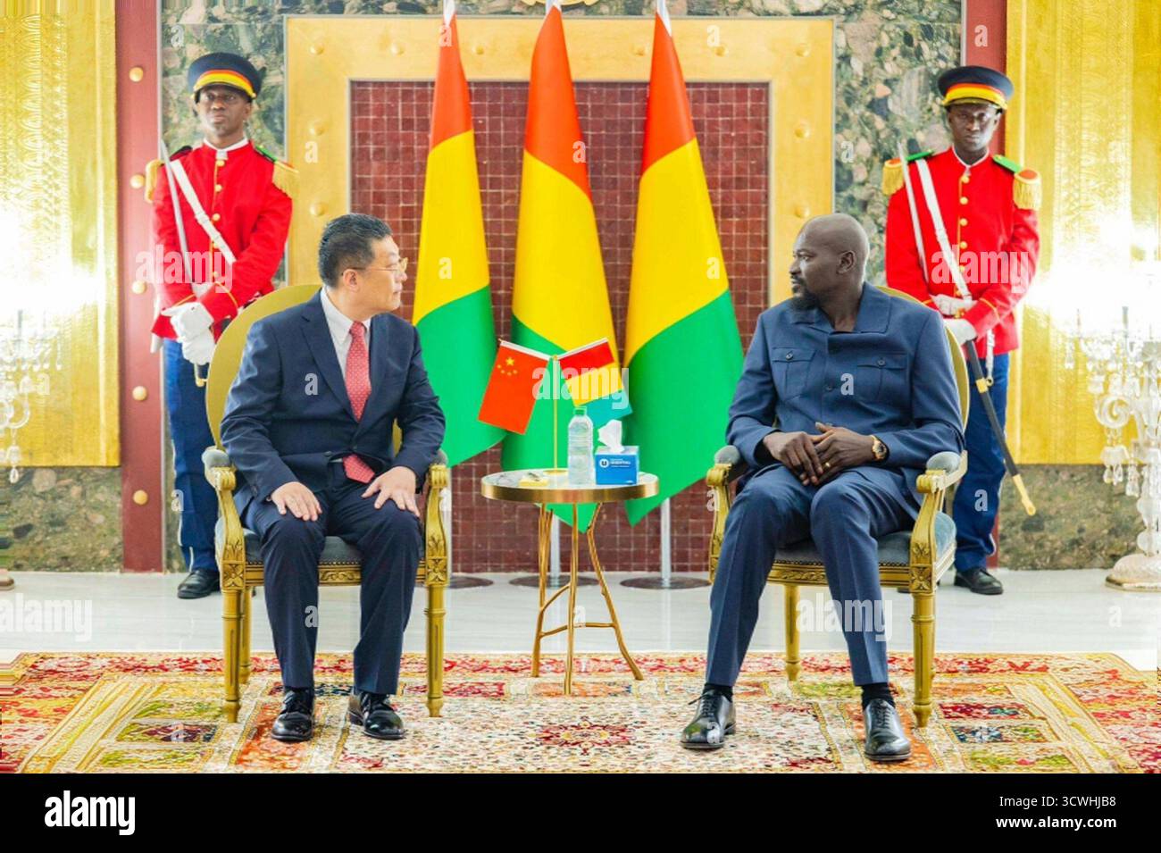 (251012) -- CONAKRY, Oct. 12, 2025 (Xinhua) -- Sun Yong (L), Chinese ...