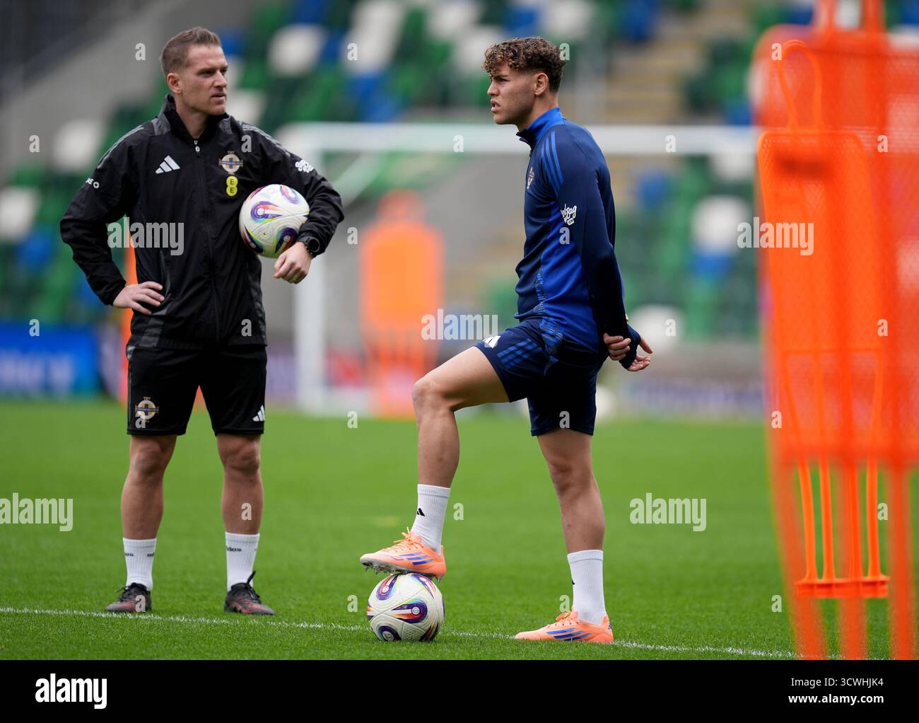 Northern Ireland's Dion Charles speaks with coach Steven Davis (left ...