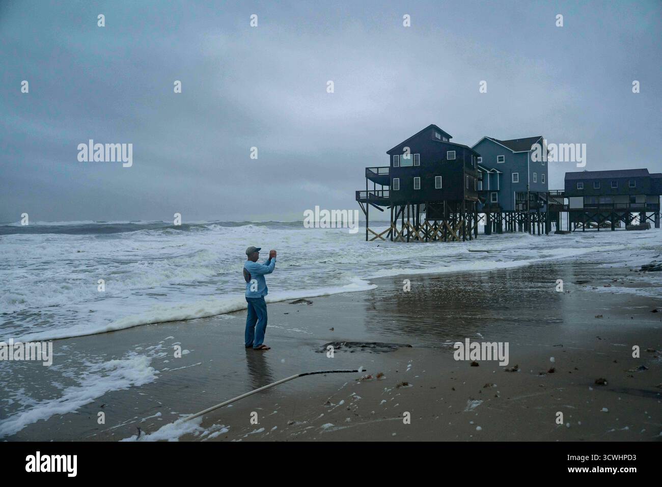 Local resident Lat Williams takes photos of his friend's houses to send ...