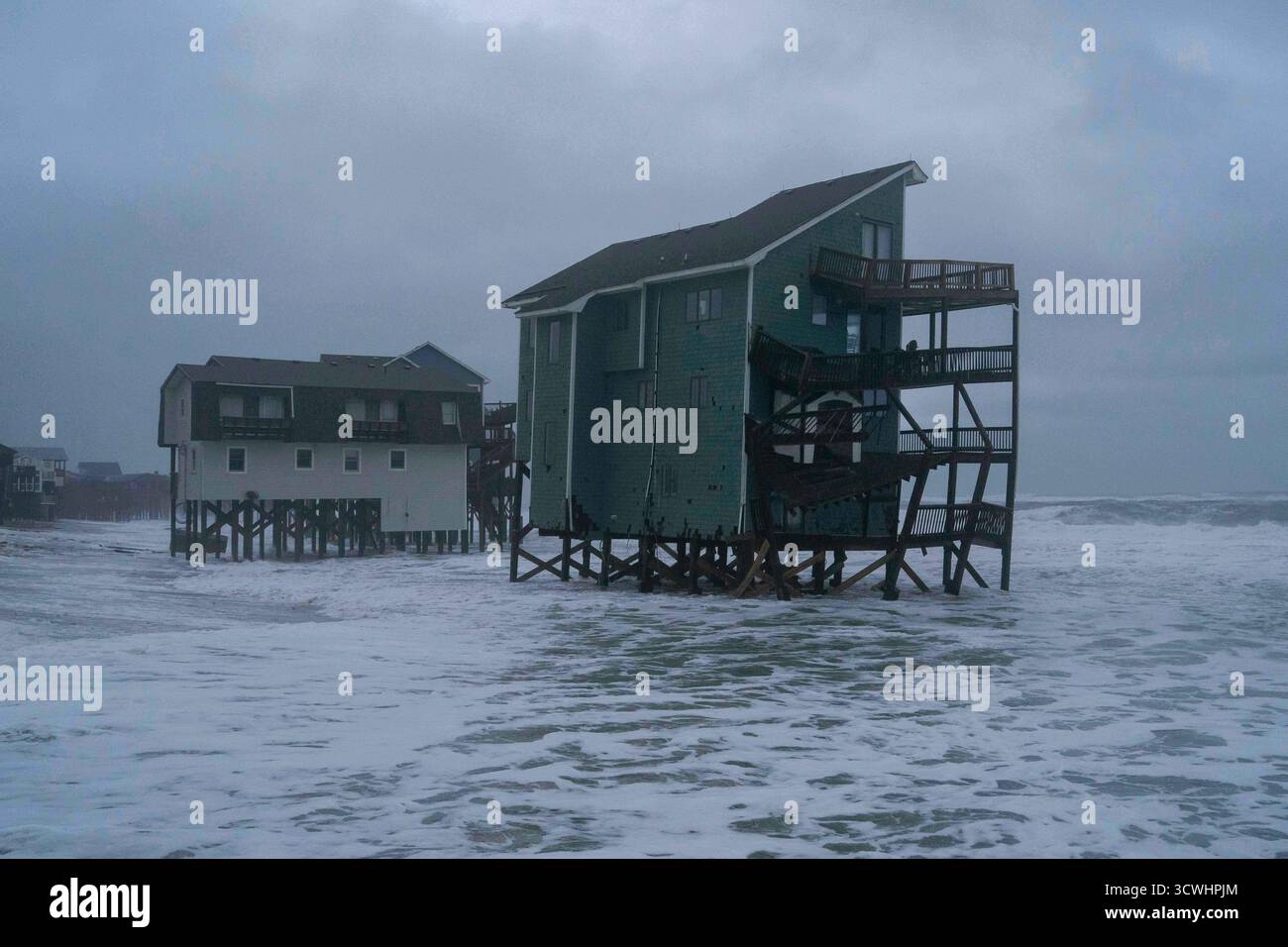 A house at risk of collapse is seen in the midst of a storm, Sunday ...
