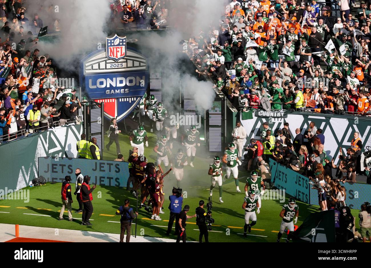 New York Jets' players run out of the tunnel onto the field ahead of ...