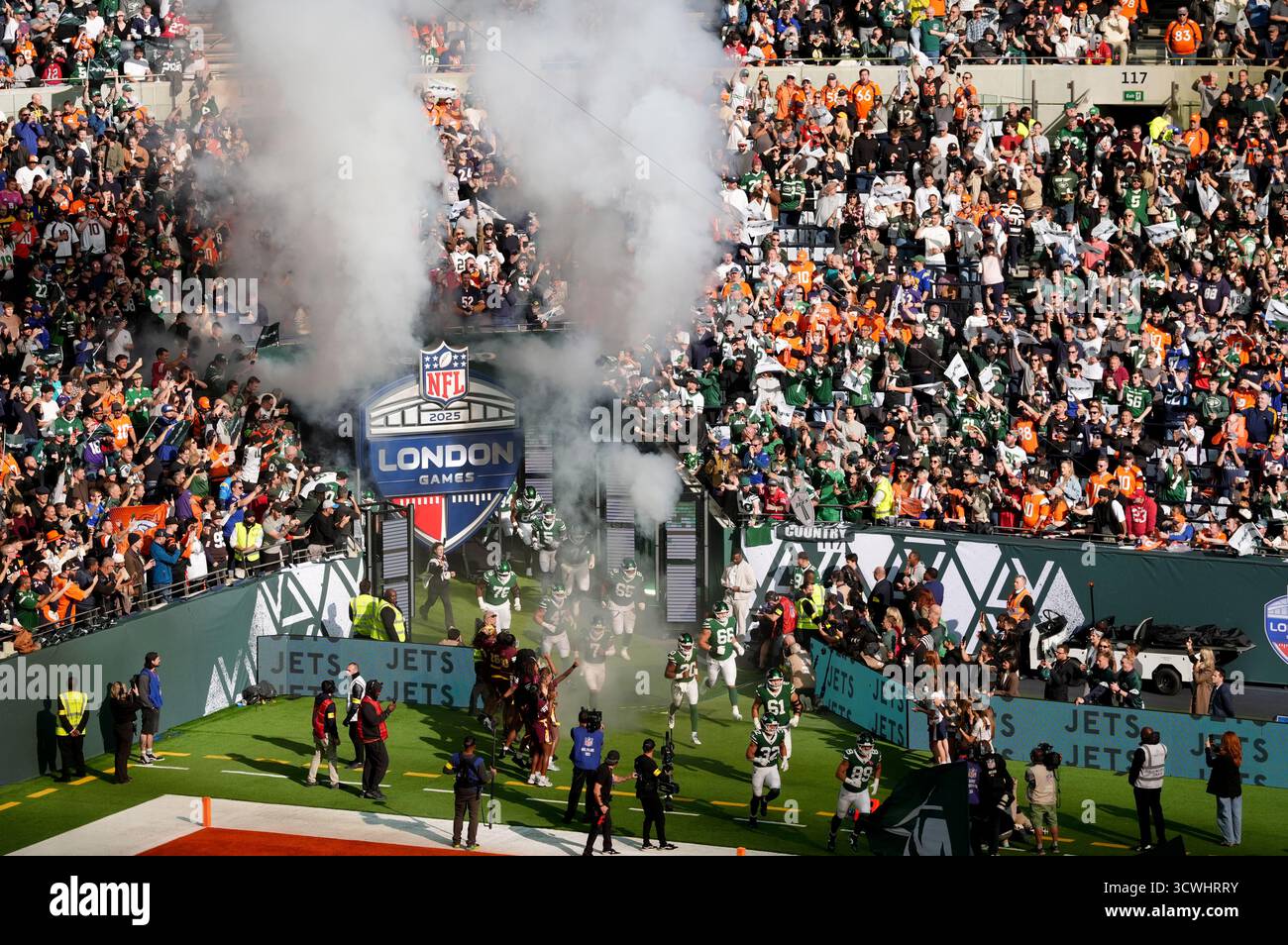 New York Jets' players run out of the tunnel onto the field ahead of ...