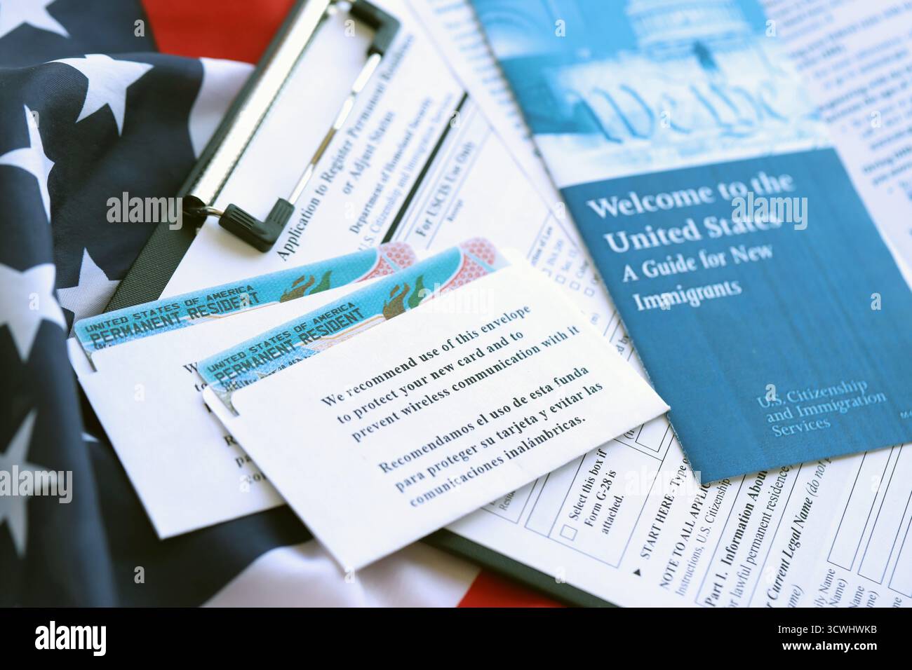 Permanent resident green card in envelope with application and guide ...