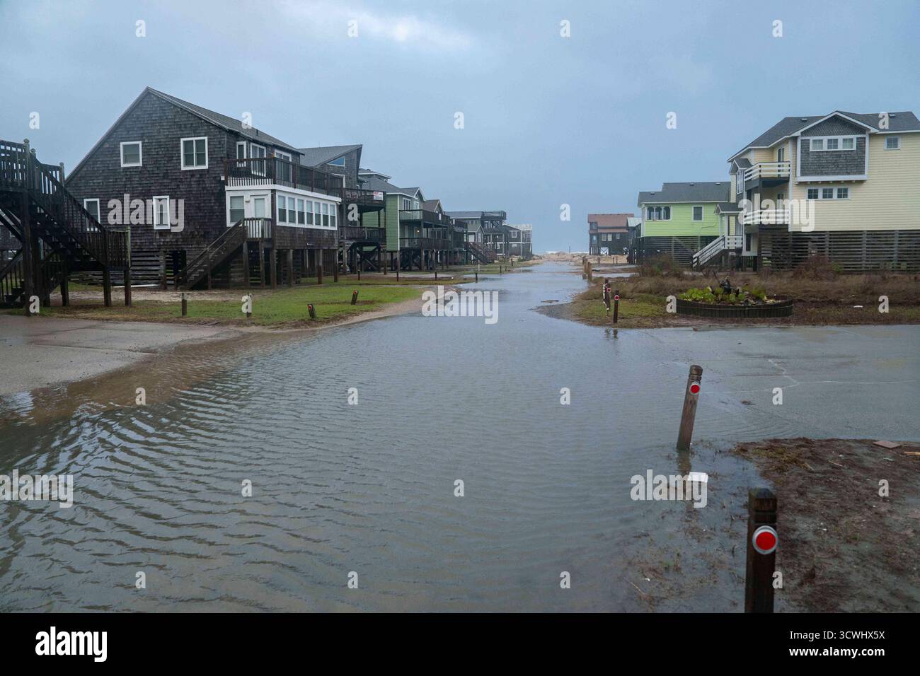 A flooded road is seen in the midst of a storm, Sunday, Oct. 12, 2025 ...
