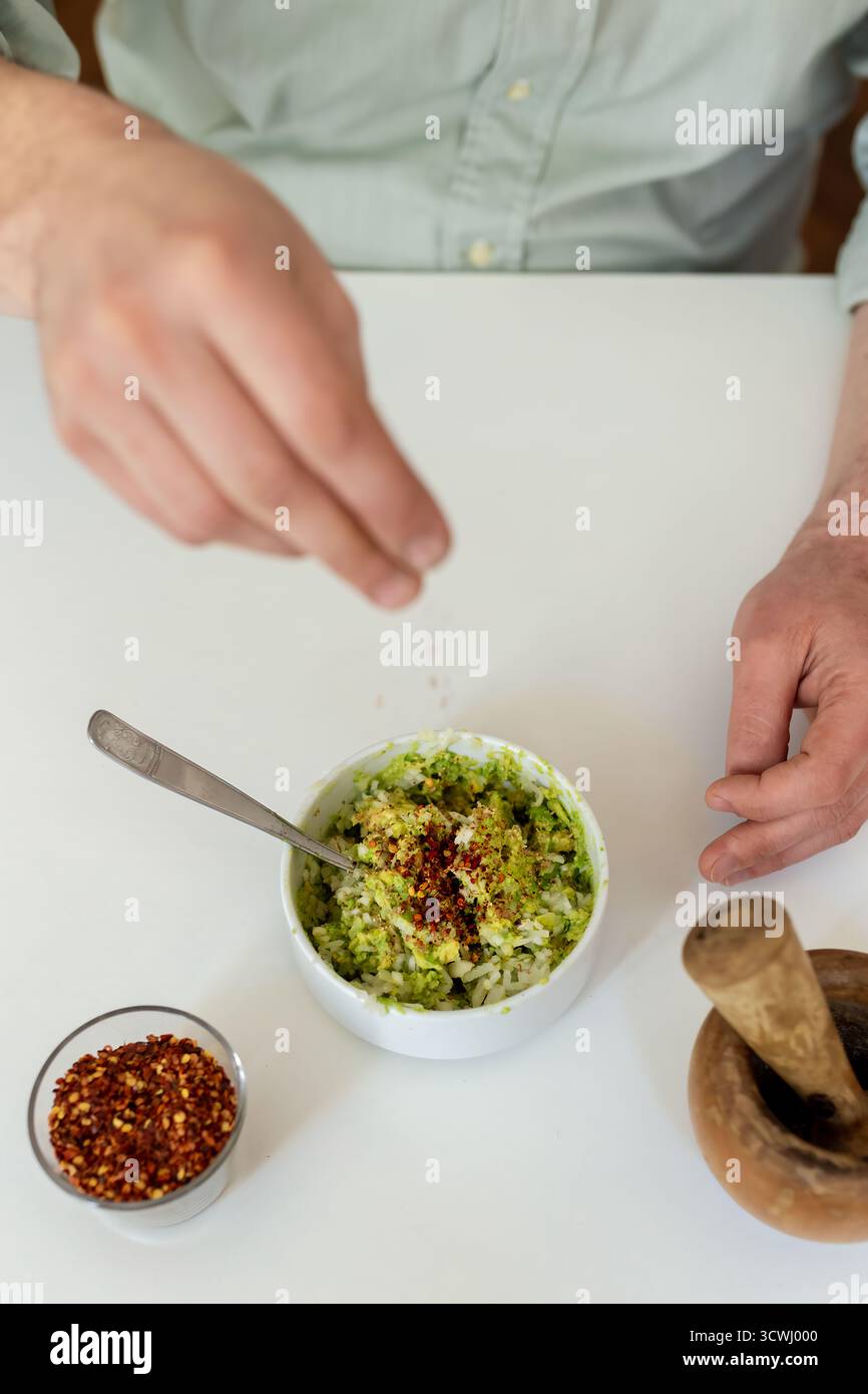 Adding spices on top vegetables hi-res stock photography and images - Alamy