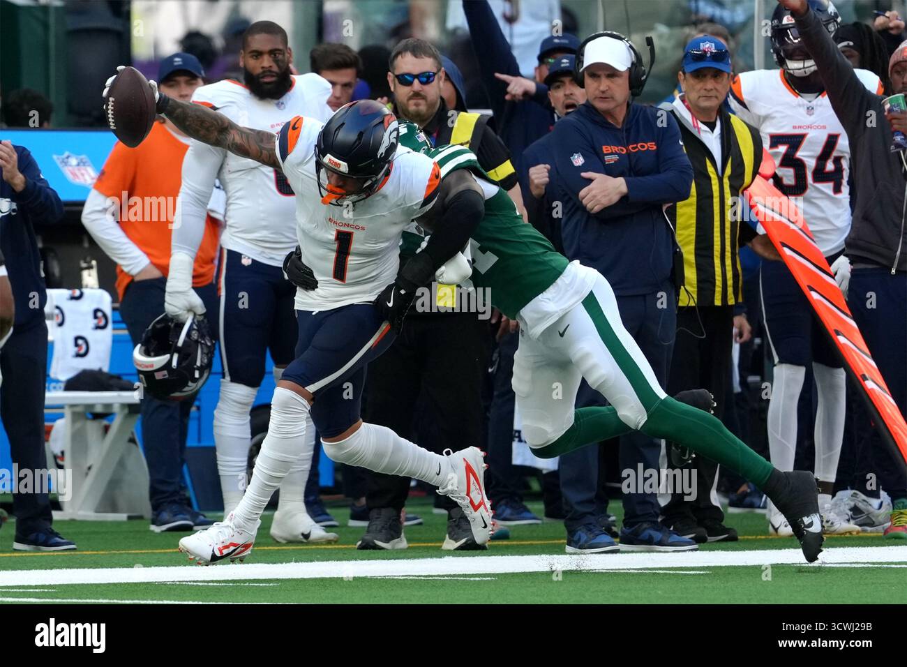 Denver Broncos tight end Evan Engram (1) tries to stay in bounds after ...