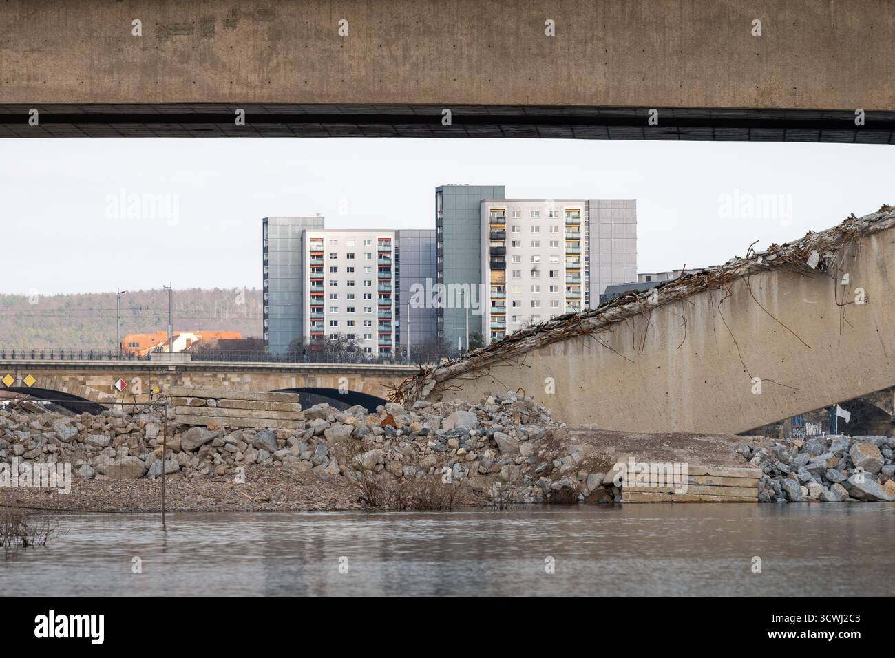 Collapsed Carola bridge lying in the Elbe river in Dresden. Broken ...