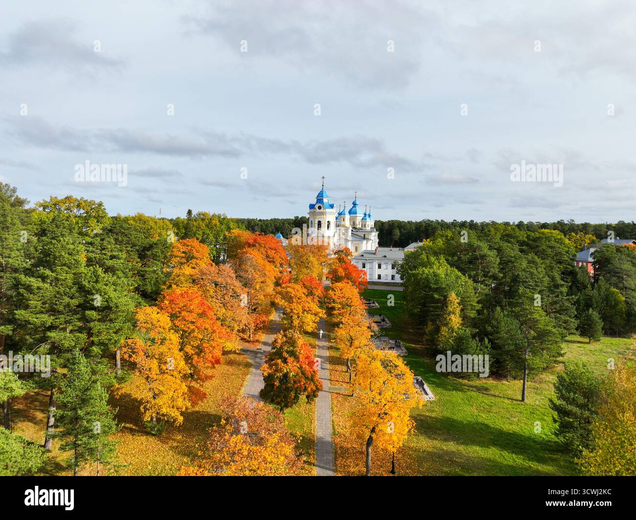 Aerial view of a historic white and blue-domed church seen through an ...