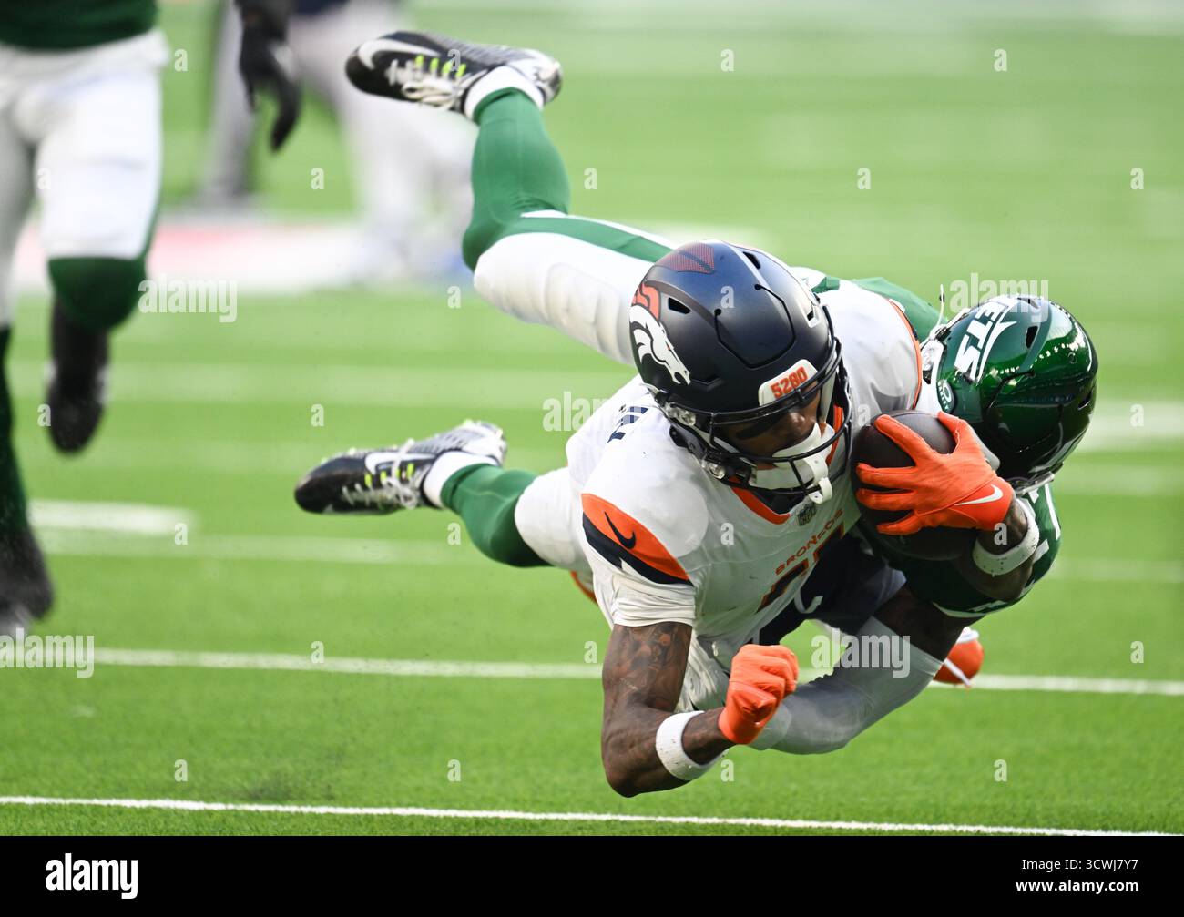 Denver Broncos #11 Troy Franklin tackled by New York Jets #27 Malachi ...