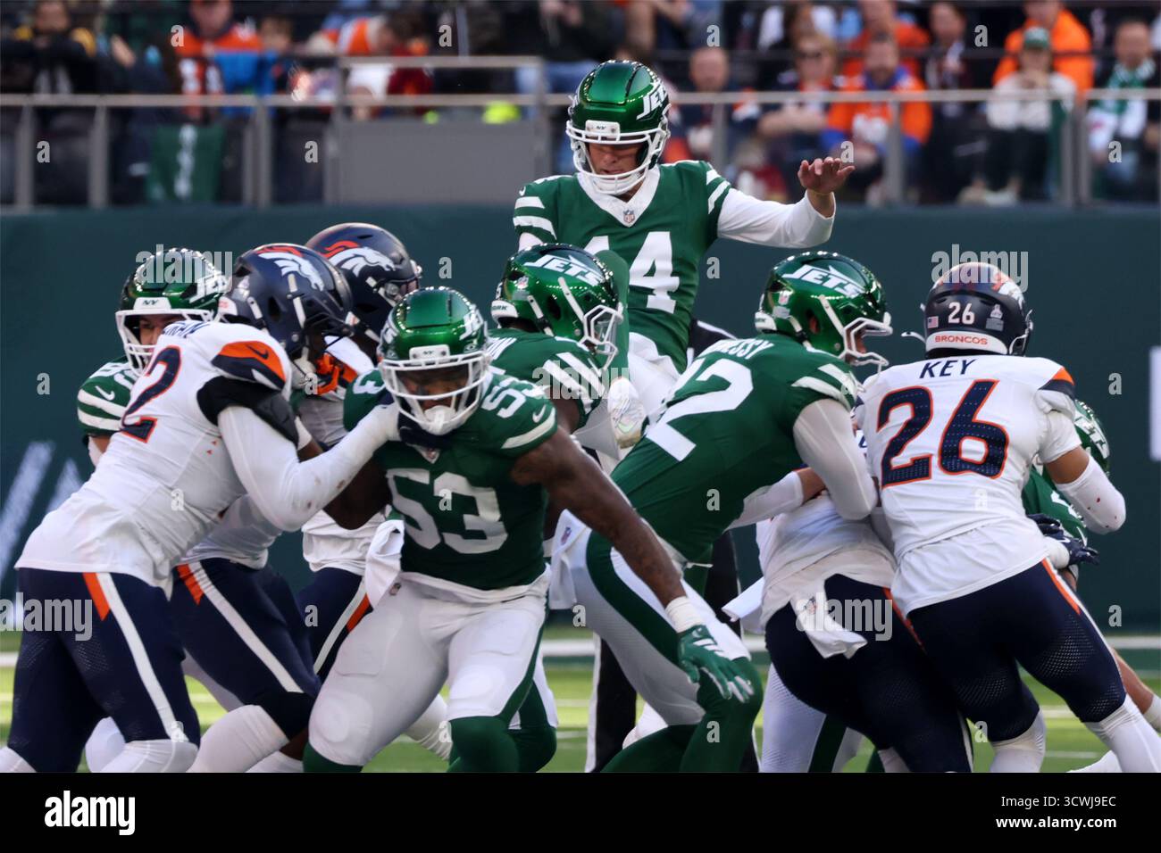 New York Jets punter Austin McNamara (14) kicks against the Denver ...